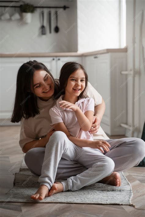 Premium Photo Mother Tickling Girl Full Shot