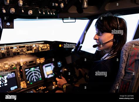 Aircrew Member Flying Plane From Cockpit With Dashboard Command And