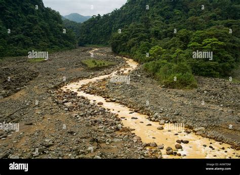 Brown Water Flowing From River Fed With Volcanic Silt Costa Rica Stock