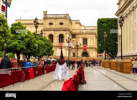 Seville Holy Week Semana Santa A Man In Traditional White Religious
