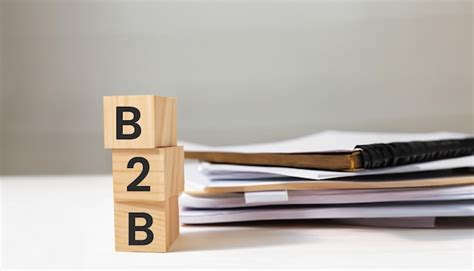 Premium Photo B2b On Wooden Cubes With Documents On Business To