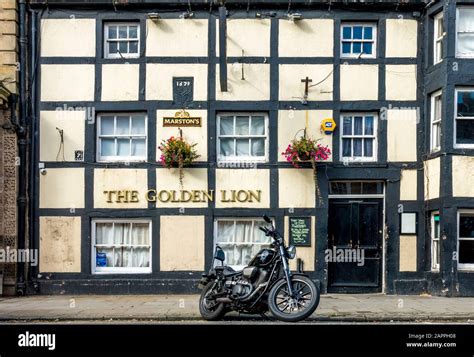 The Golden Lion Pub With Motorbike Parked Outside The Oldest Pub In