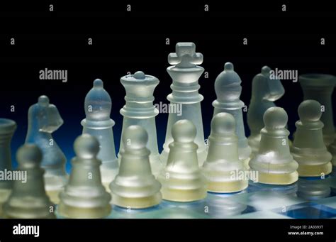 Decorative Glass Chess Set Back Lighted With Dark Background Stock