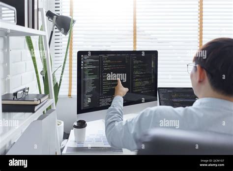 Software Development Concept Male Programmer Checking Data Codes On