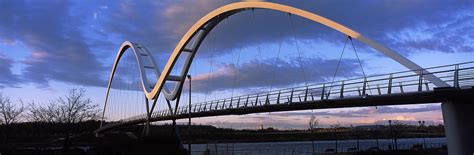 Modern Bridge Over A River Infinity Photograph By Panoramic Images