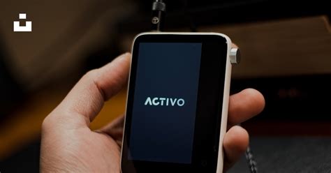 A Person Holding A Smart Phone With The Word Activq On It Photo Free Gadget Image On Unsplash
