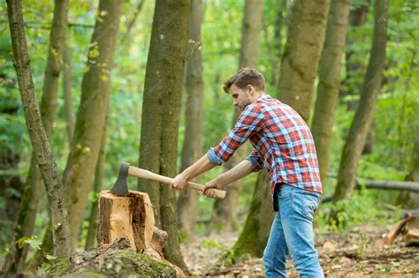 Premium Photo Just One Hit Chopping And Splitting Firewood With Axe Lumber Worker In Wood