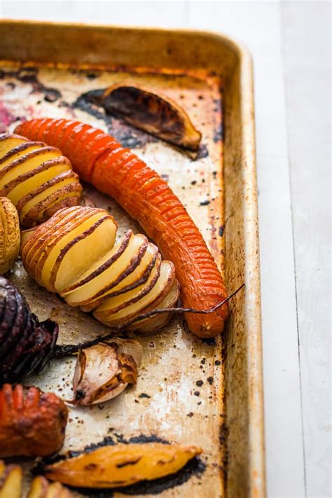 Garlic Hasselback Potatoes And Root Vegetables With Yoghurt Dill