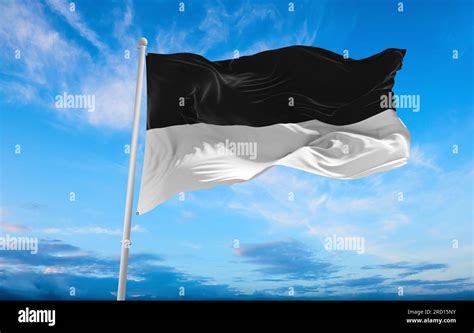 Flag Of Historic Peoples Prussian Germans At Cloudy Sky Background