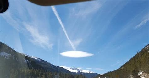 Disc Shaped Cloud Pierced By A Jets Trail East Of Frisco Co On I70