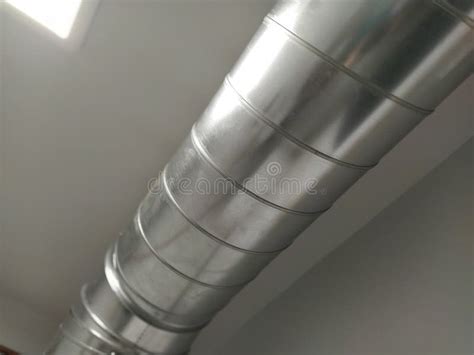 Extractor Hood In A Public Toilet Round Metal Pipe With Gray Air