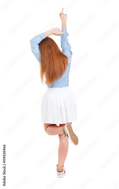 Back View Of Pointing Woman Beautiful Redhead Girl Rear View People