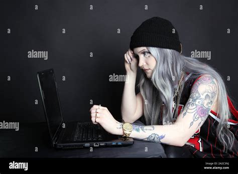 Side View Of Millennial Woman On Laptop Looking At Blank Screen Low Key Stock Photo Alamy