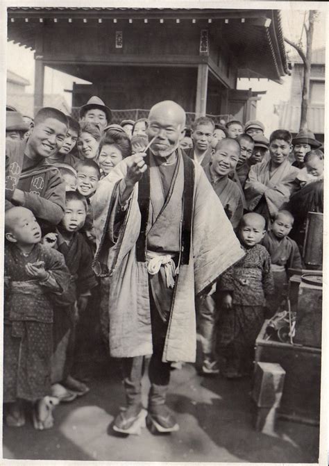 A Group Standing Around A Man Holding Something In His Han Flickr