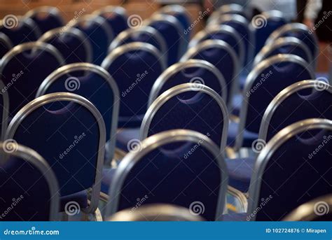 Rows Of Empty Metal Chairs In A Large Assembly Hallempty Chairs In