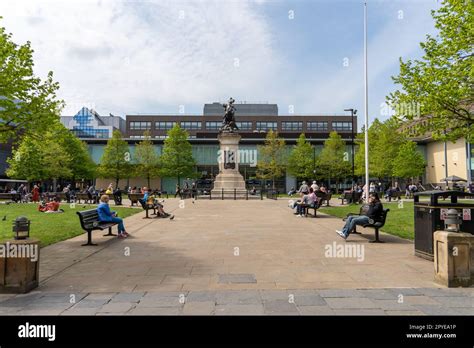 A View Of The Statue Of St George And People Spending Time In Old Eldon