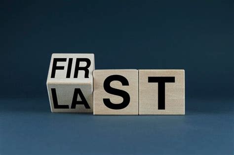 Premium Photo Cubes Form The Words First Or Last Business Success Concept