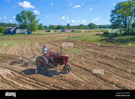 Otsego Michigan A 90 Year Old Farmer Drives A Farmall Model M