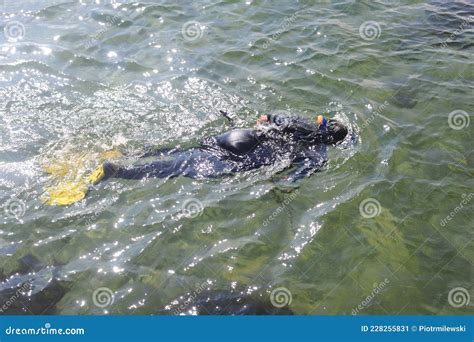 Young Diver Preparing An Underwater Compass For Diving Royalty Free
