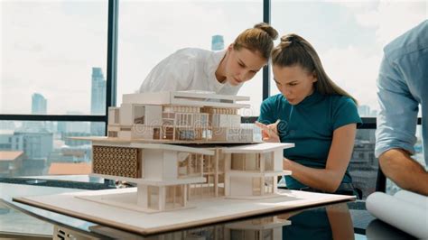 Engineers Measure Model While Manager Using Laptop Analysis Data