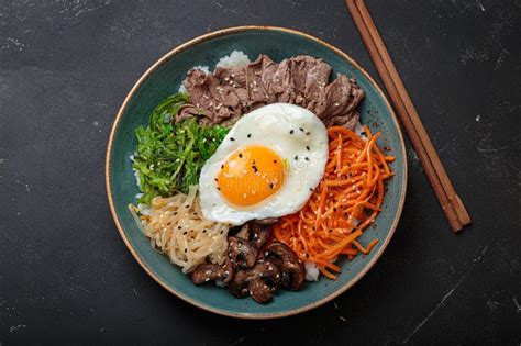 Traditional Korean Bibimbap With Fried Egg Beef And Vegetables And