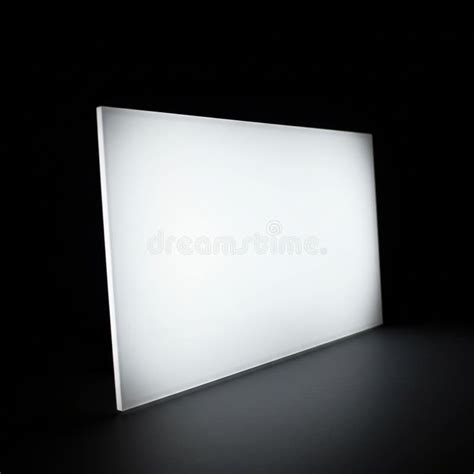 A Glowing Rectangular Light Panel Positioned Against A Dark Background Casting A Soft Stock
