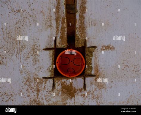 Orange Round Plastic Backbox For Socket Or Switch Inserted Into The