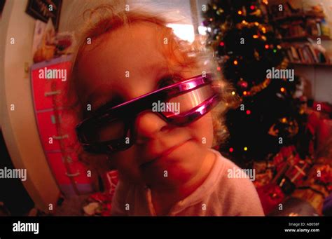 Close Up Of A Young Girl Modeling A Purple Pair Of Sunglasses She Got