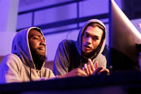 Premium Photo Hackers Discussing Criminal Activity