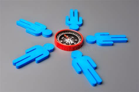 A Compass Surrounded By Blue Figures Stock Image Image Of Mission