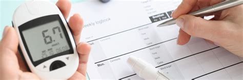 Premium Photo Patient Holding Glucometer And Recording Data In Diary