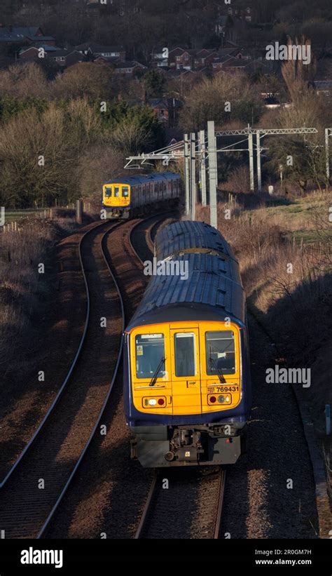 2 Northern Rail Class 769 Flex Bi Mode Trains Passing At Lostock