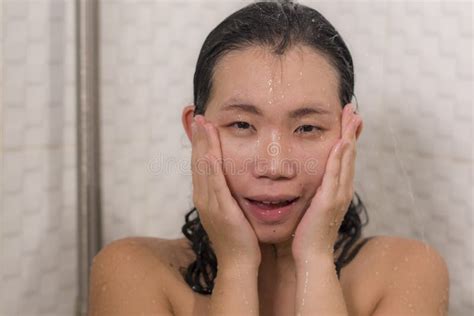 Young Beautiful And Happy Asian Chinese Woman Taking A Shower In The