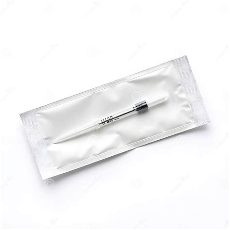 A Disposable Needle In Sterile Packaging Lying Flat On A White Backdrop