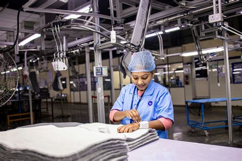 Worker Assembling Clothing In A Textile Factory Photo Free Woman