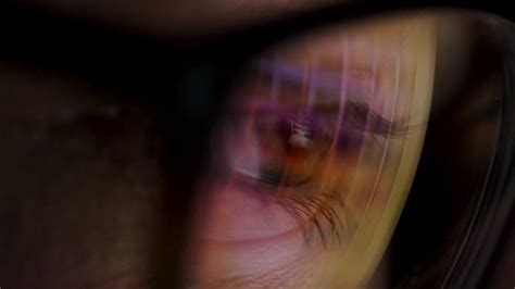 Woman In Glasses Looking On The Monitor And Surfing Internet The