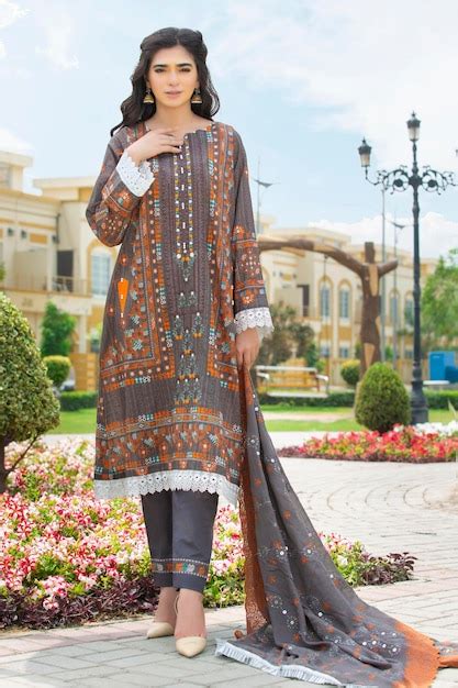 Premium Photo Beautiful Girl Standing In Park Wearing Desi Dress
