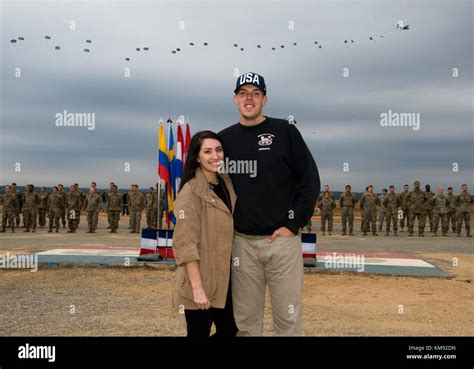 Catherine Brake And Zachary Oler The Son Of Randy Oler Pose As Paratroopers Drop And Are
