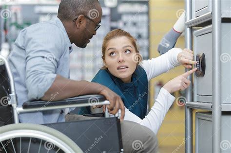Woman Assisting Man In Wheelchair Stock Image Image Of Team Smiling