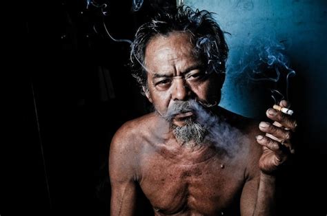 Premium Photo Indonesian Man Smoking A Ciggarette