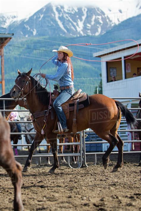 Caucasian Cowgirl Riding Horse In Rodeo On Ranch Royalty Free Stock