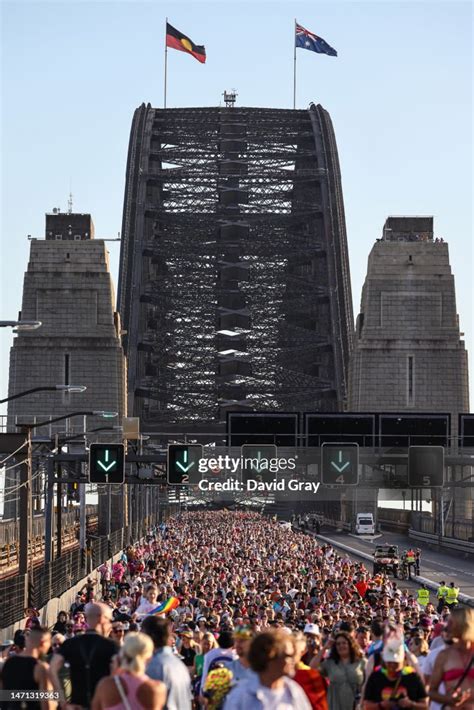 People Take Part In Pride March Over The Sydney Harbour Bridge On