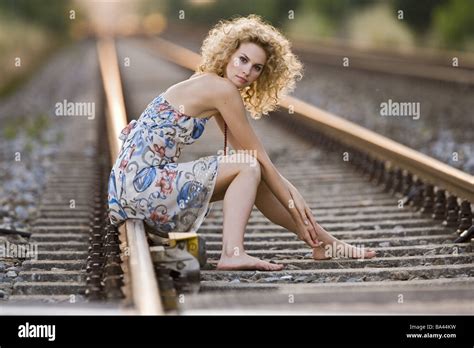Woman Young Summer Dress Barefoot Railroad Rails Sits Thoughtfully