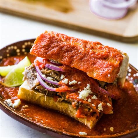 Delicious Torta Ahogada Mouthwatering Carnitas In Red Chile Sauce
