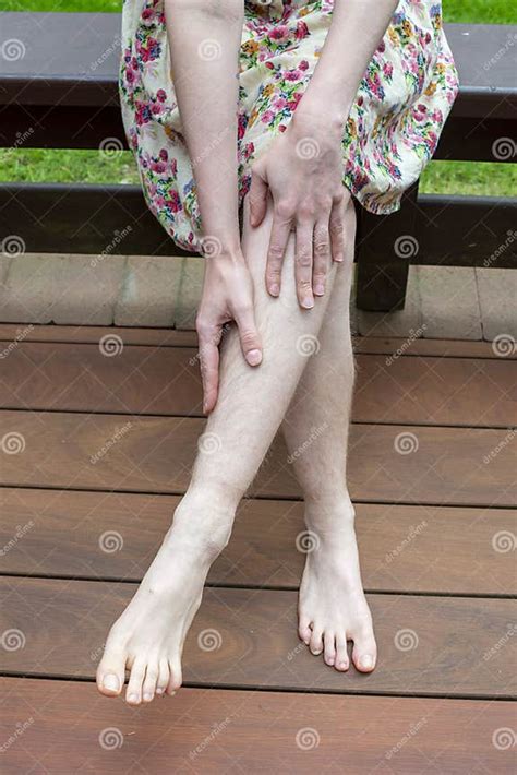 Natural Unshaved Hairy Legs Of A Body Positive Young Woman Stock Image