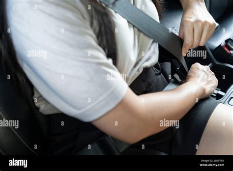 Close Up Of Hand Woman Pulling Seat Belt In Her Car Car Safety Concept