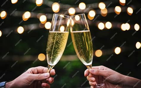 Premium Photo Glasses Filled With Effervescent Champagne Sparkle Beneath A Canopy Of Twinkling