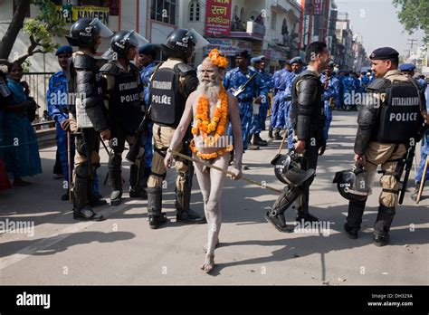 One Naked Sadhu With Marigold Flowers Garland Passing Through Police Security In Kumbh Fair