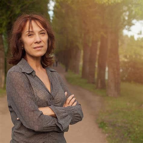 Premium Photo Beautiful Mature Woman In Summer Park Outdoors