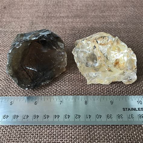 2 Rough Quartz Chunks One Smokey Quartz Piece And One Clear Quartz